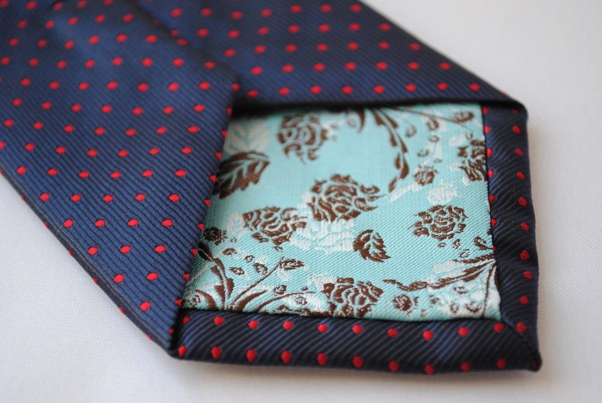 navy and red pin spot design tie with signature floral design to rear ...